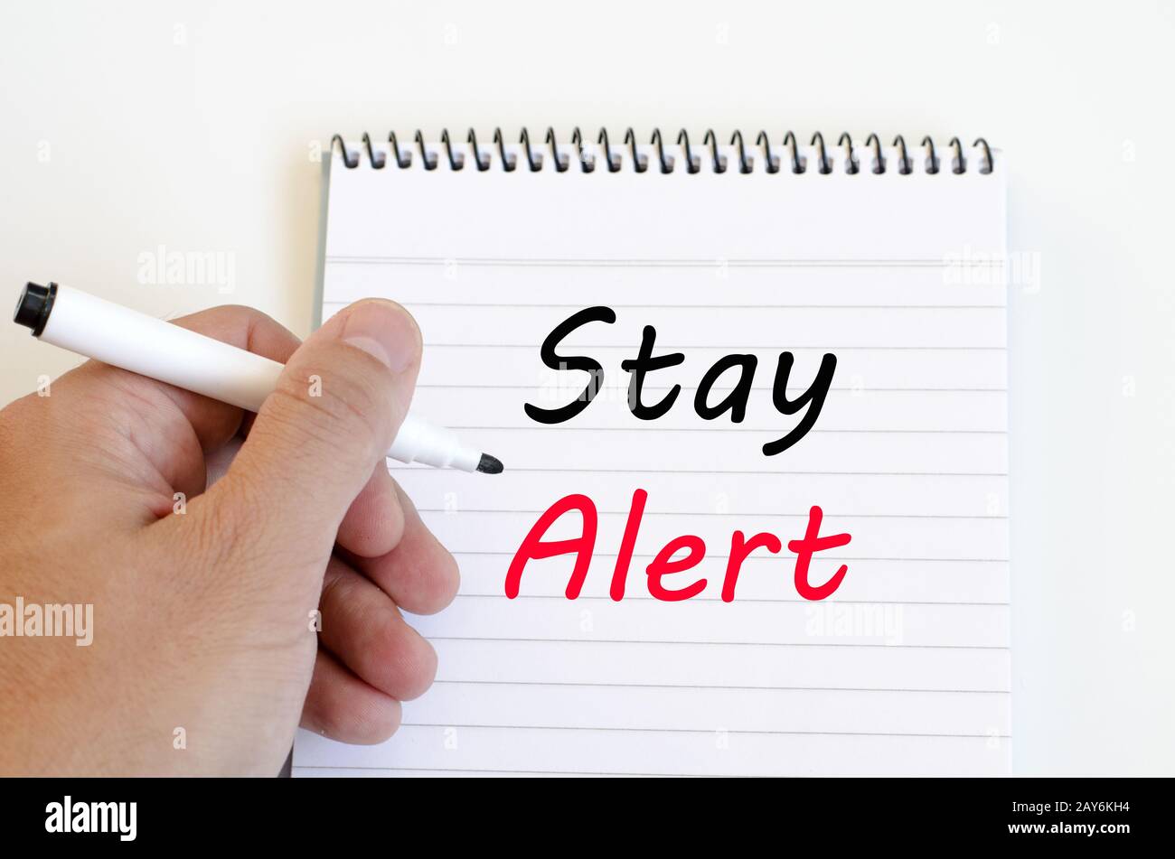 Stay alert concept on notebook Stock Photo - Alamy
