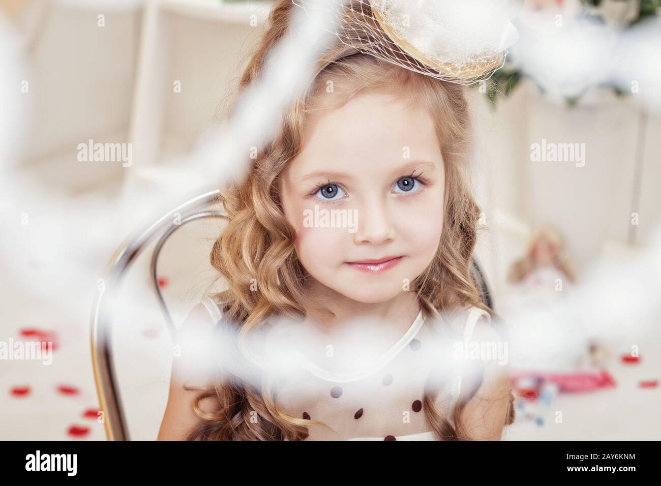 Portrait of adorable little girl looking at camera Stock Photo - Alamy