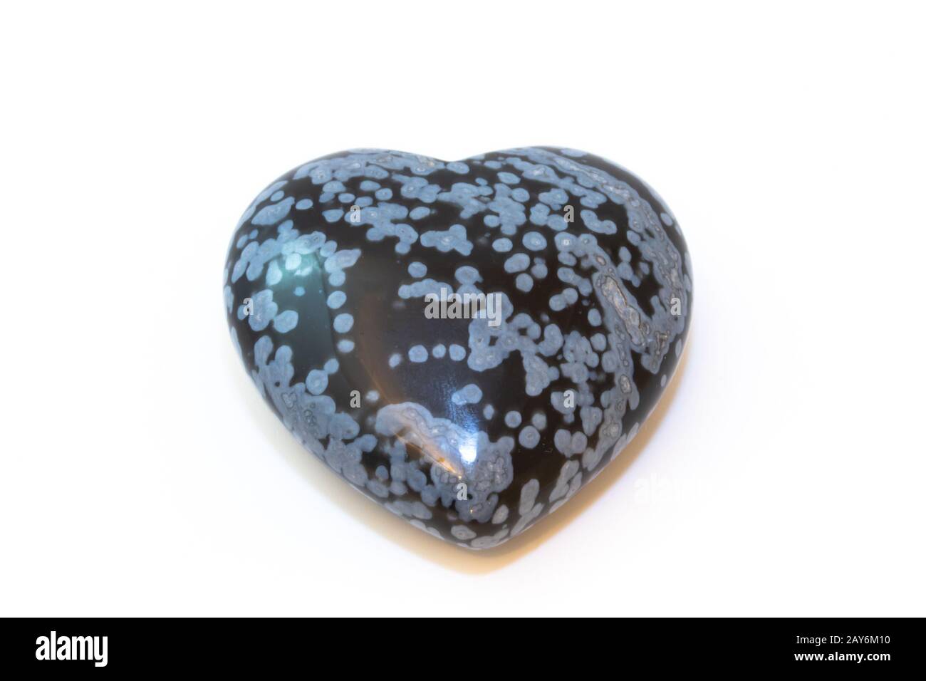 Stone obsidian in shape of heart on white background Stock Photo - Alamy