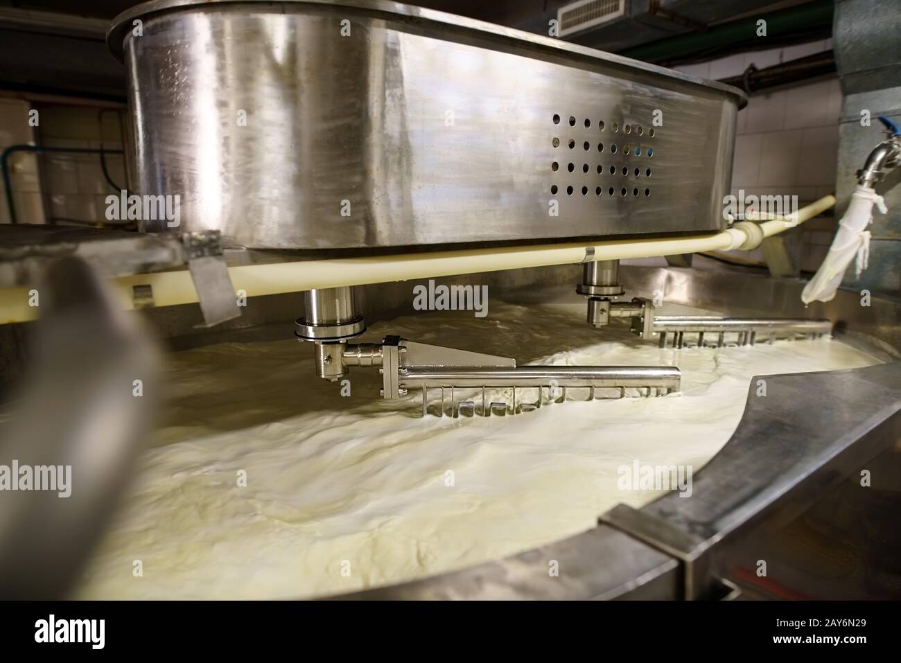 Process of mixing at dairy production line Stock Photo - Alamy