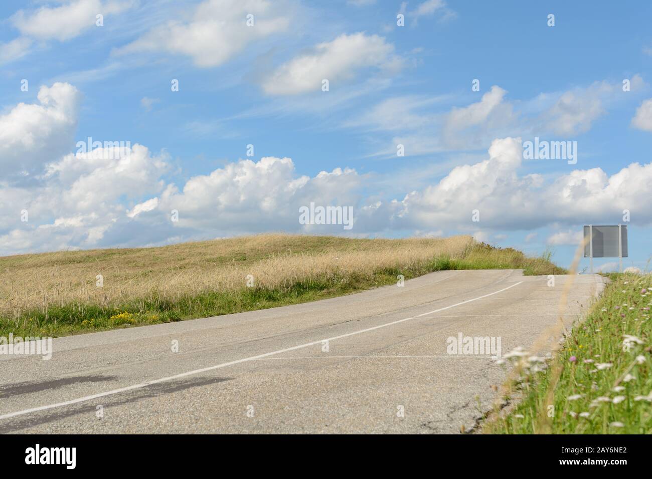 An old road with a barrier line ends as a dead end Stock Photo - Alamy