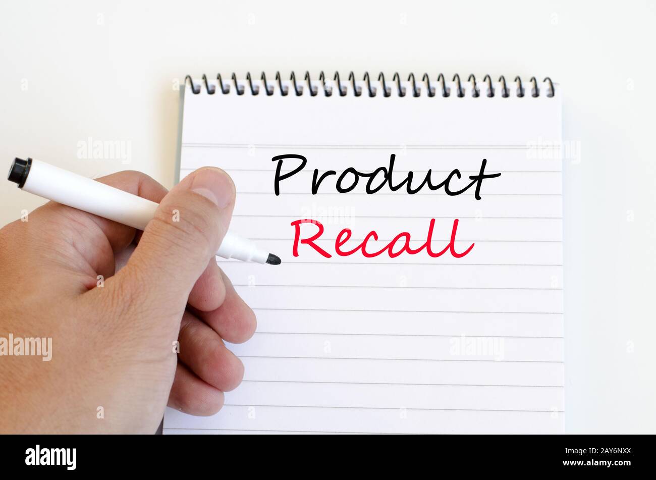 Human hand over wooden background and product recall text concept Stock ...