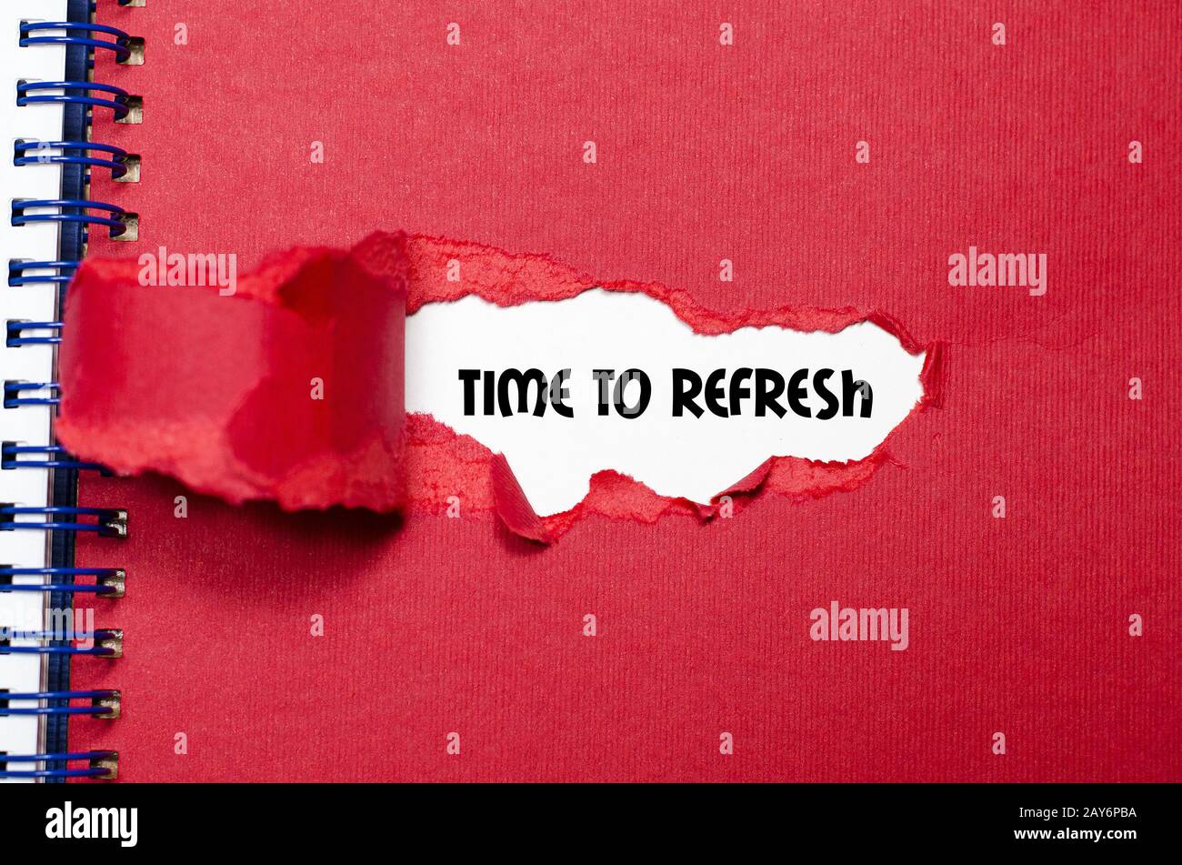 The word time to refresh appearing behind torn paper Stock Photo - Alamy