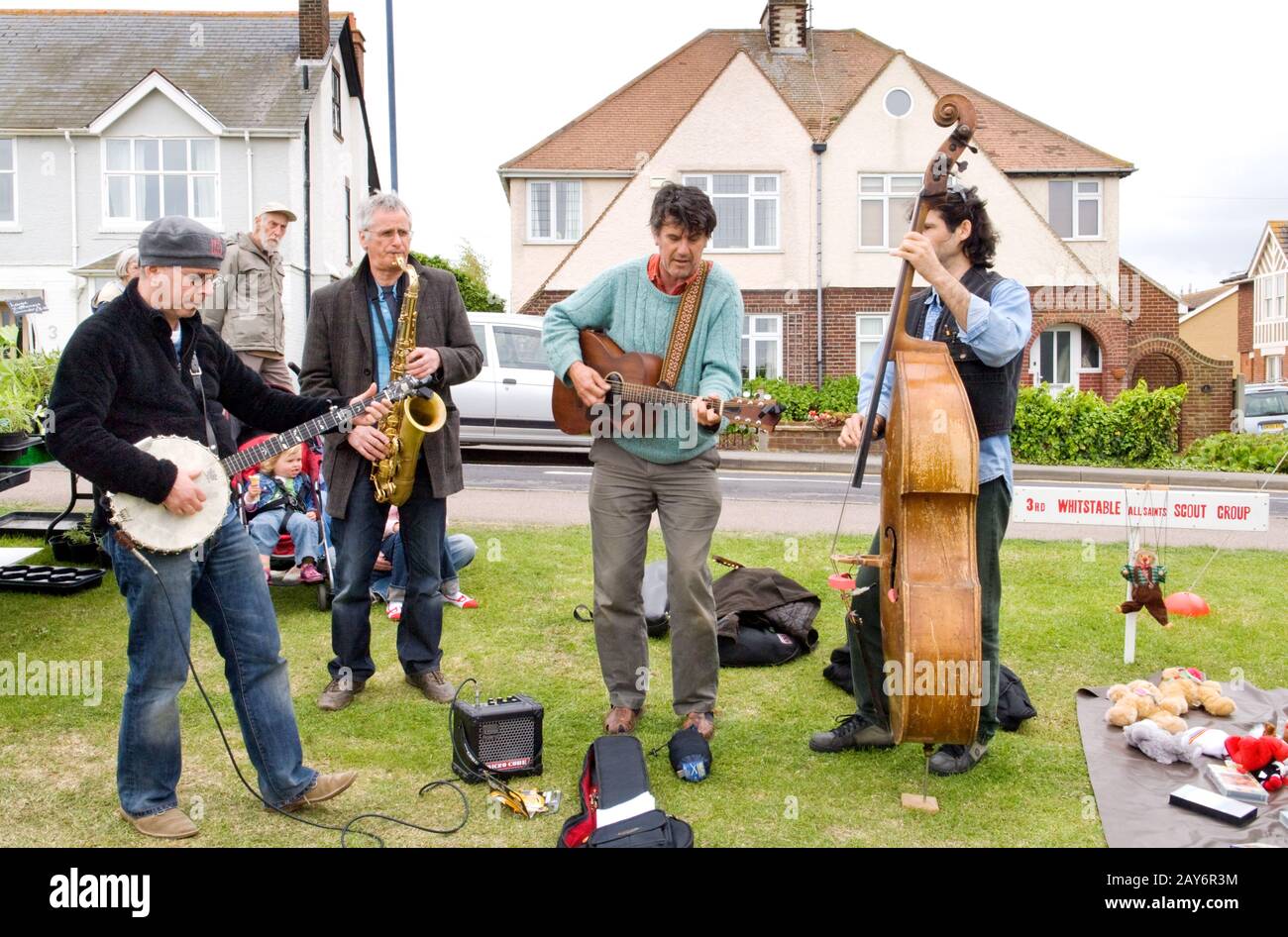 Street band busking at a local fair Stock Photo - Alamy