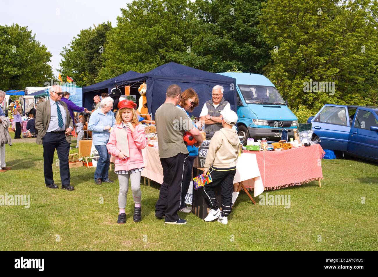 Various people and stands at a local fair Stock Photo - Alamy