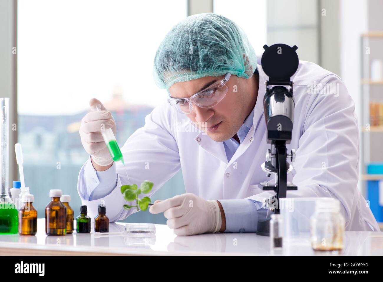 Biotechnology concept with scientist in lab Stock Photo - Alamy