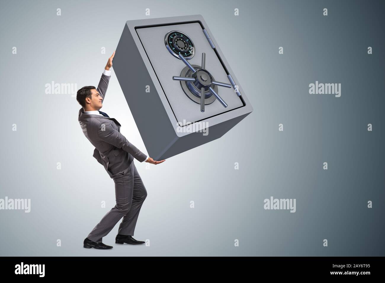 Businessman carrying metal safe in security concept Stock Photo - Alamy
