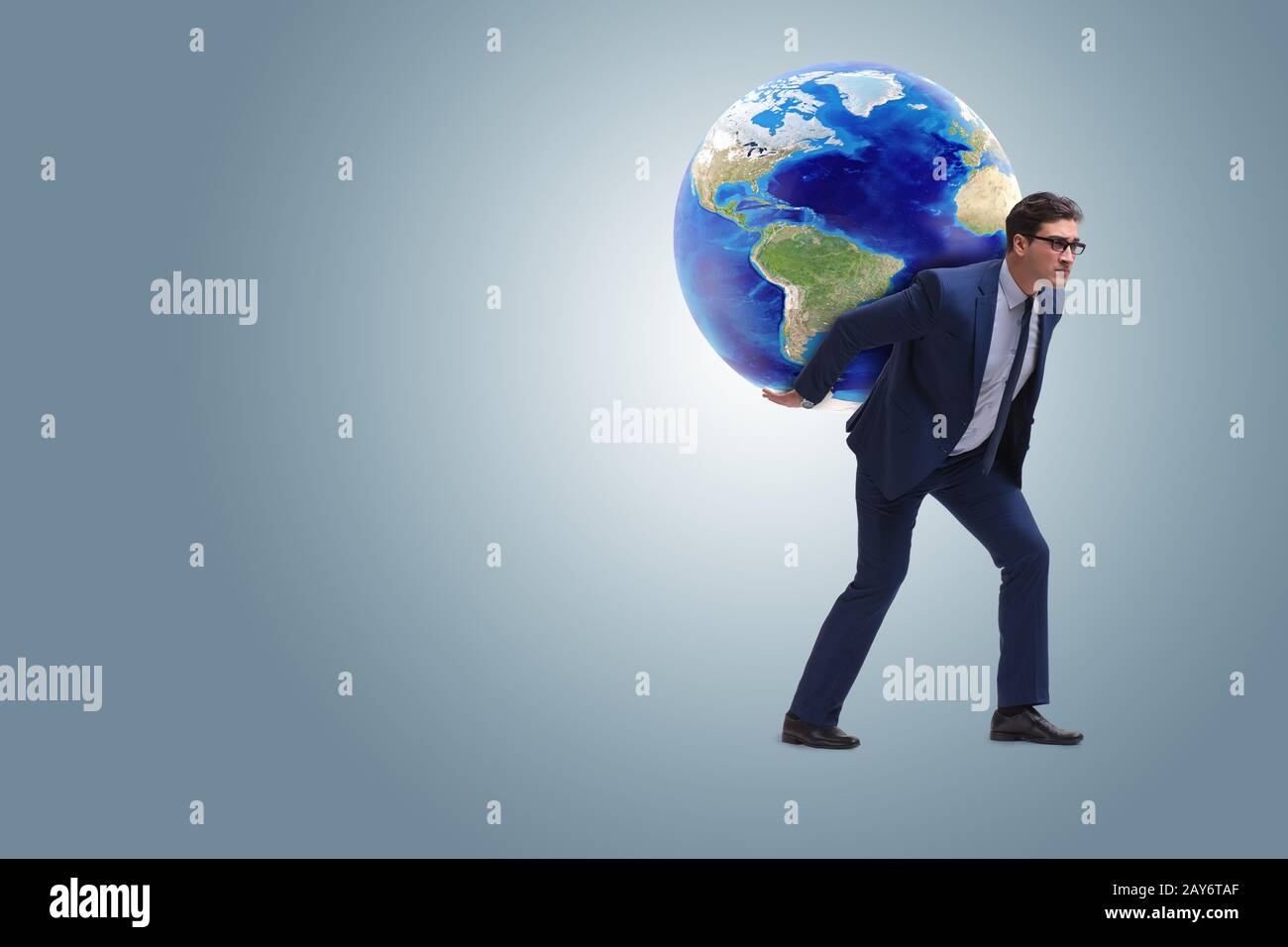 Businessman carrying earth on shoulders hi-res stock photography and ...
