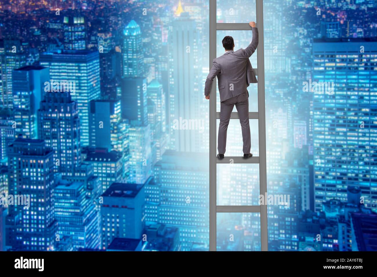 Young businessman climbing career ladder Stock Photo - Alamy