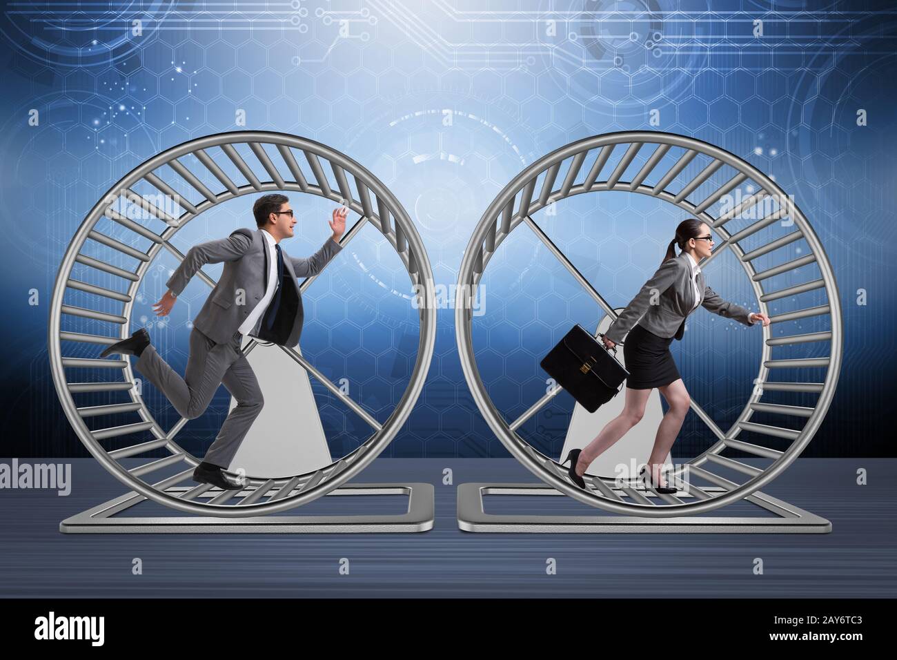 Business concept with pair running on hamster wheel Stock Photo - Alamy