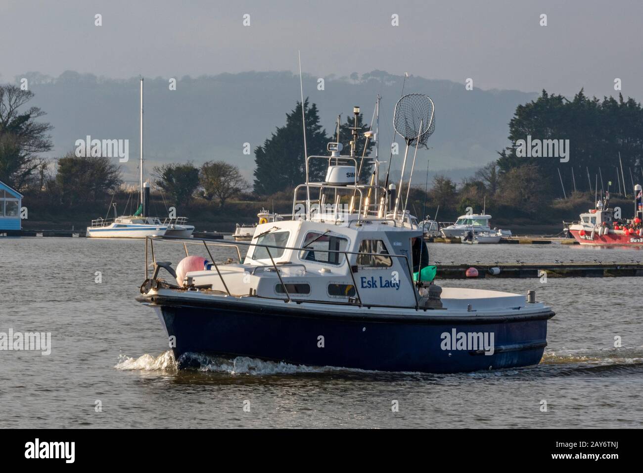 a fishing boat full of anglers and fishermen on a day angling trip from ...