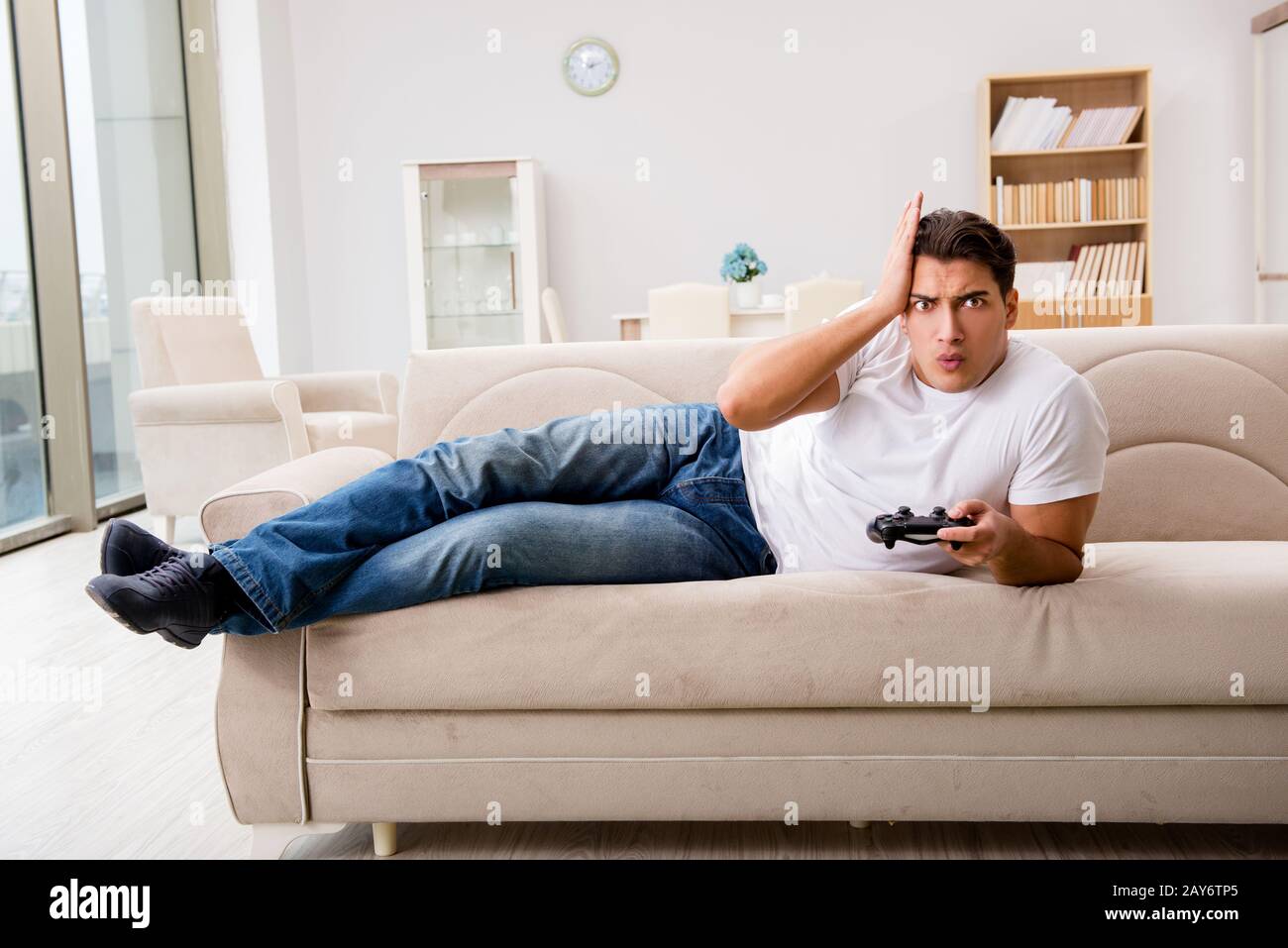 Man addicted to computer games Stock Photo - Alamy