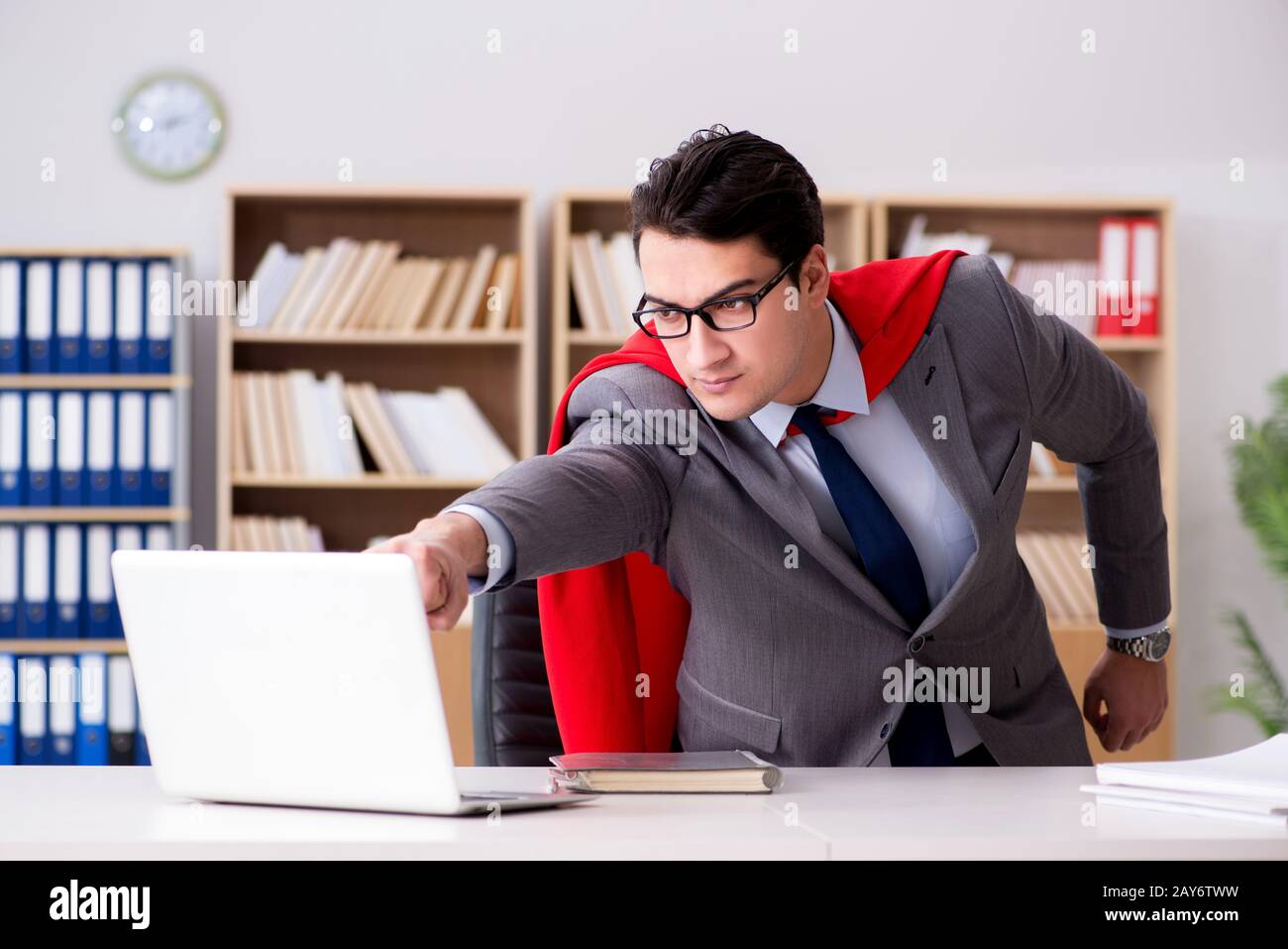 Superhero businessman working in the office Stock Photo - Alamy