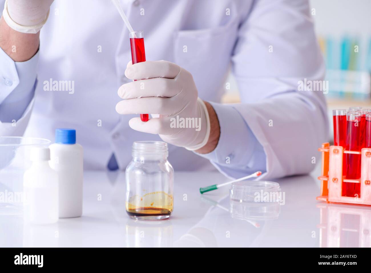 Blood testing in the lab with young scientist Stock Photo - Alamy