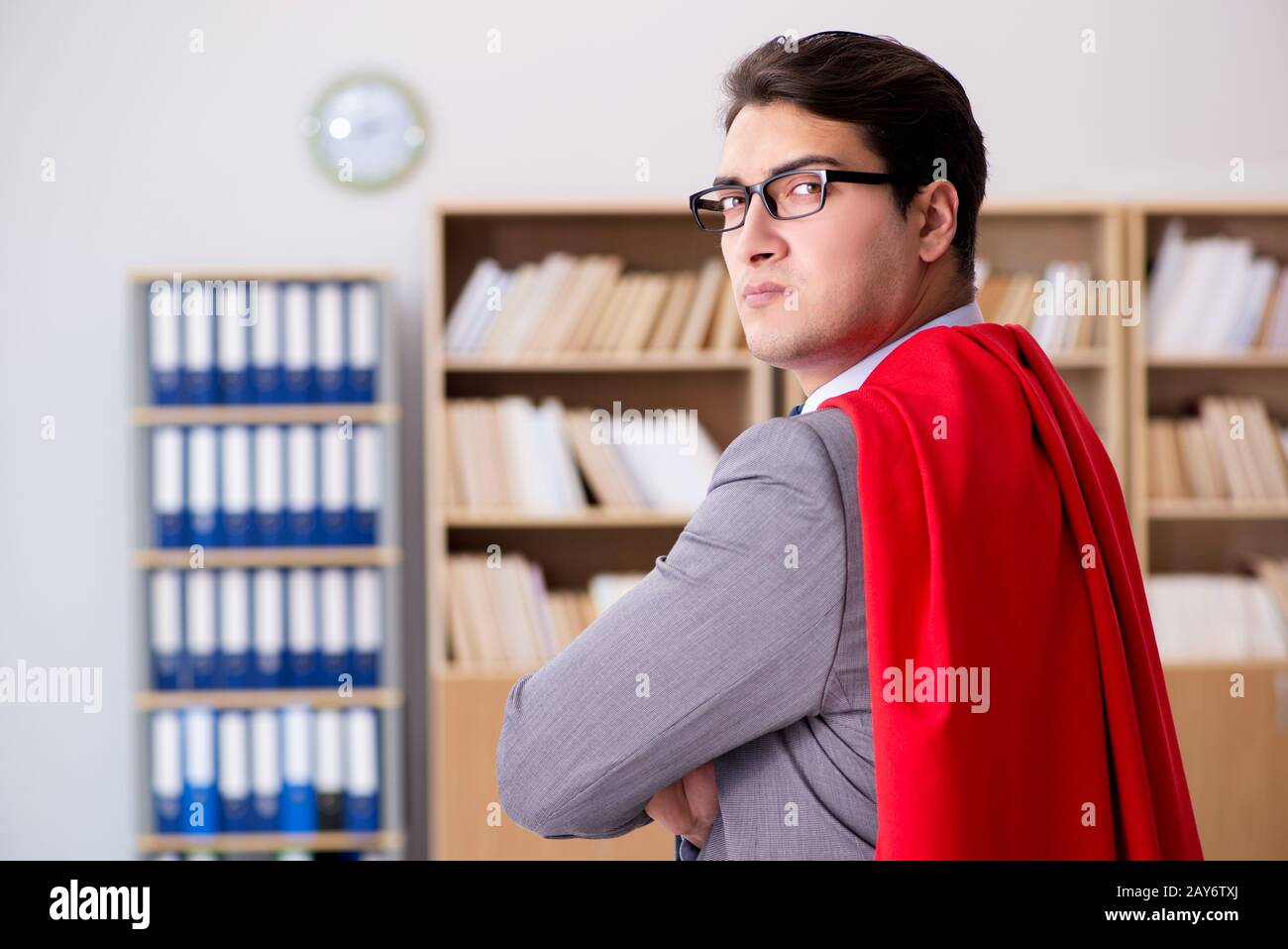 Superhero businessman working in the office Stock Photo - Alamy