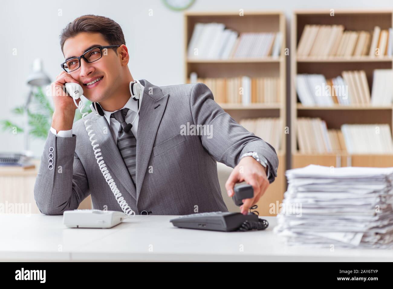 Angry helpdesk operator in the office Stock Photo - Alamy