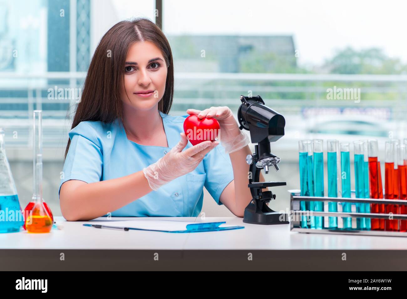 Young female doctor working in the lab Stock Photo - Alamy