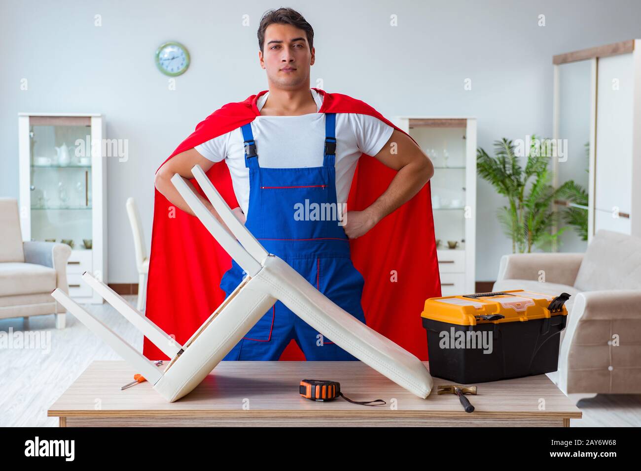 Super hero repairman working at home Stock Photo - Alamy