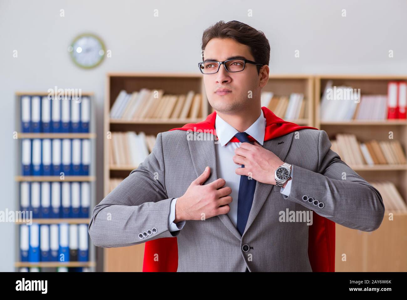 Superhero businessman working in the office Stock Photo - Alamy
