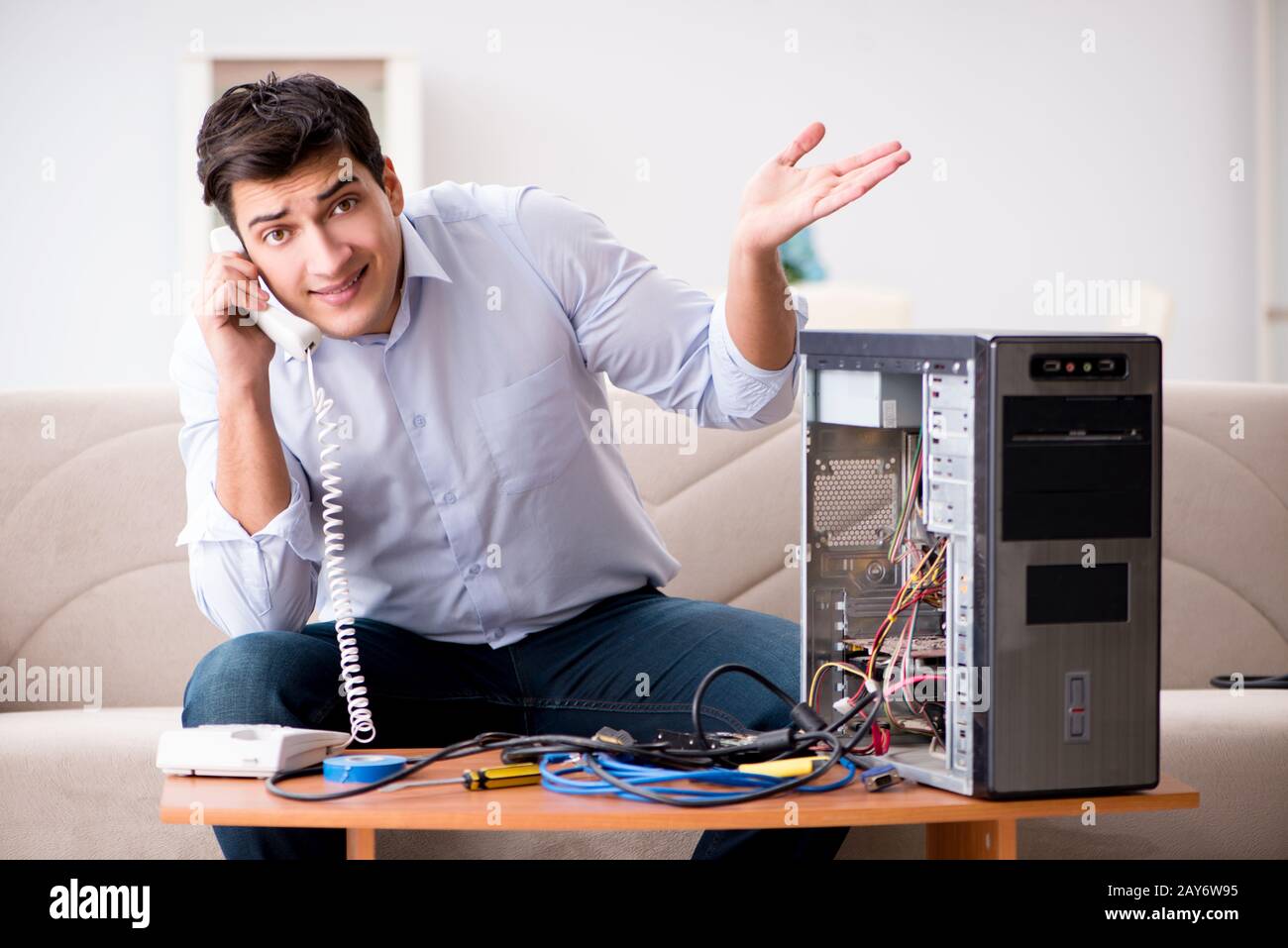 Angry customer trying to repair computer with phone support Stock Photo ...