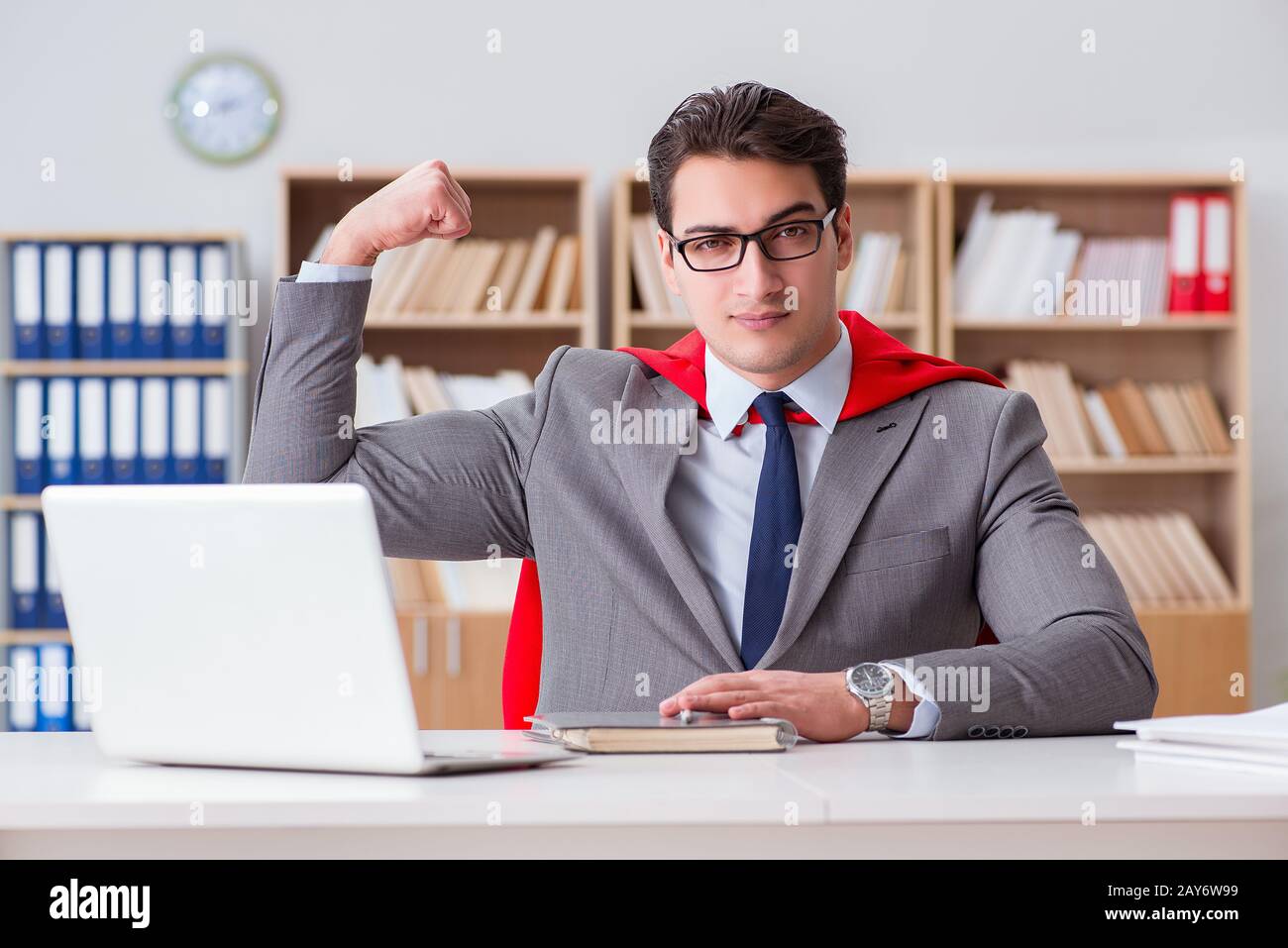 Superhero businessman working in the office Stock Photo - Alamy