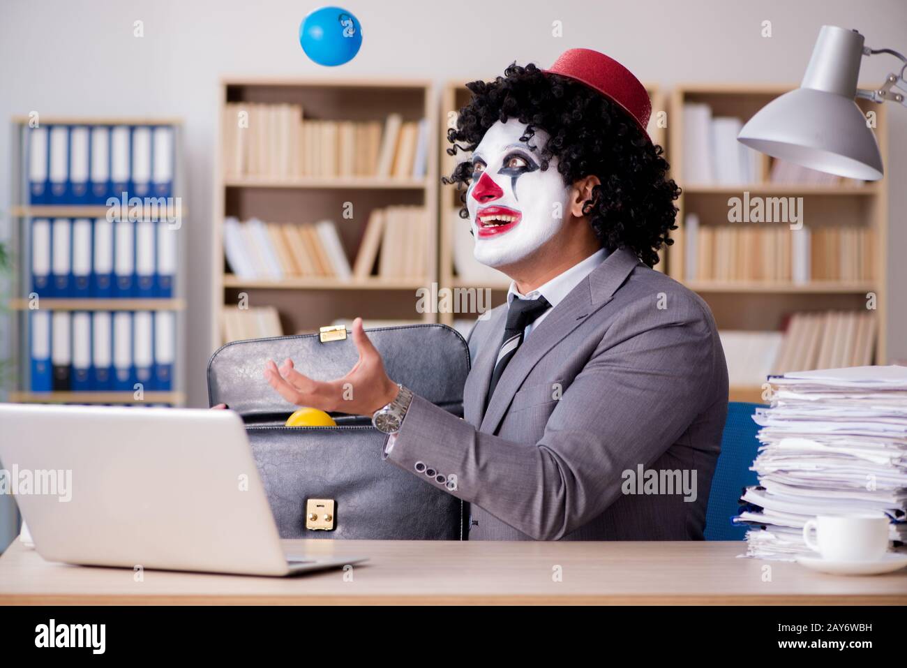 Clown businessman working in the office Stock Photo - Alamy