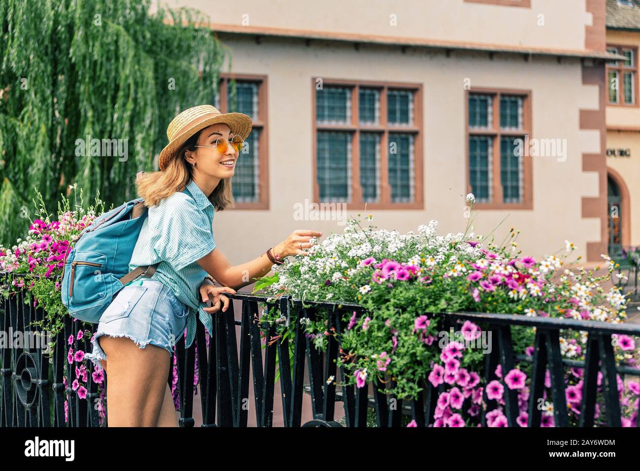 Backpacker women tourist standing on a beautiful bridge somewhere in ...