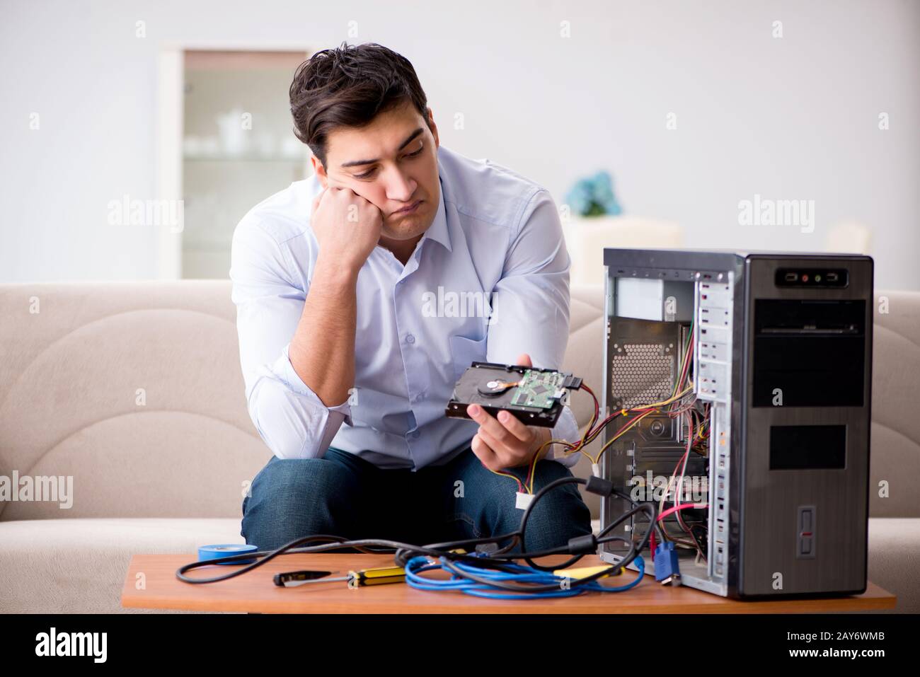 Frustrated man with broken pc computer Stock Photo - Alamy