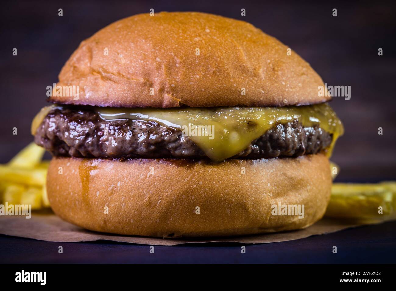 Craft beef burger with cheese on wood table and rustic background Stock ...