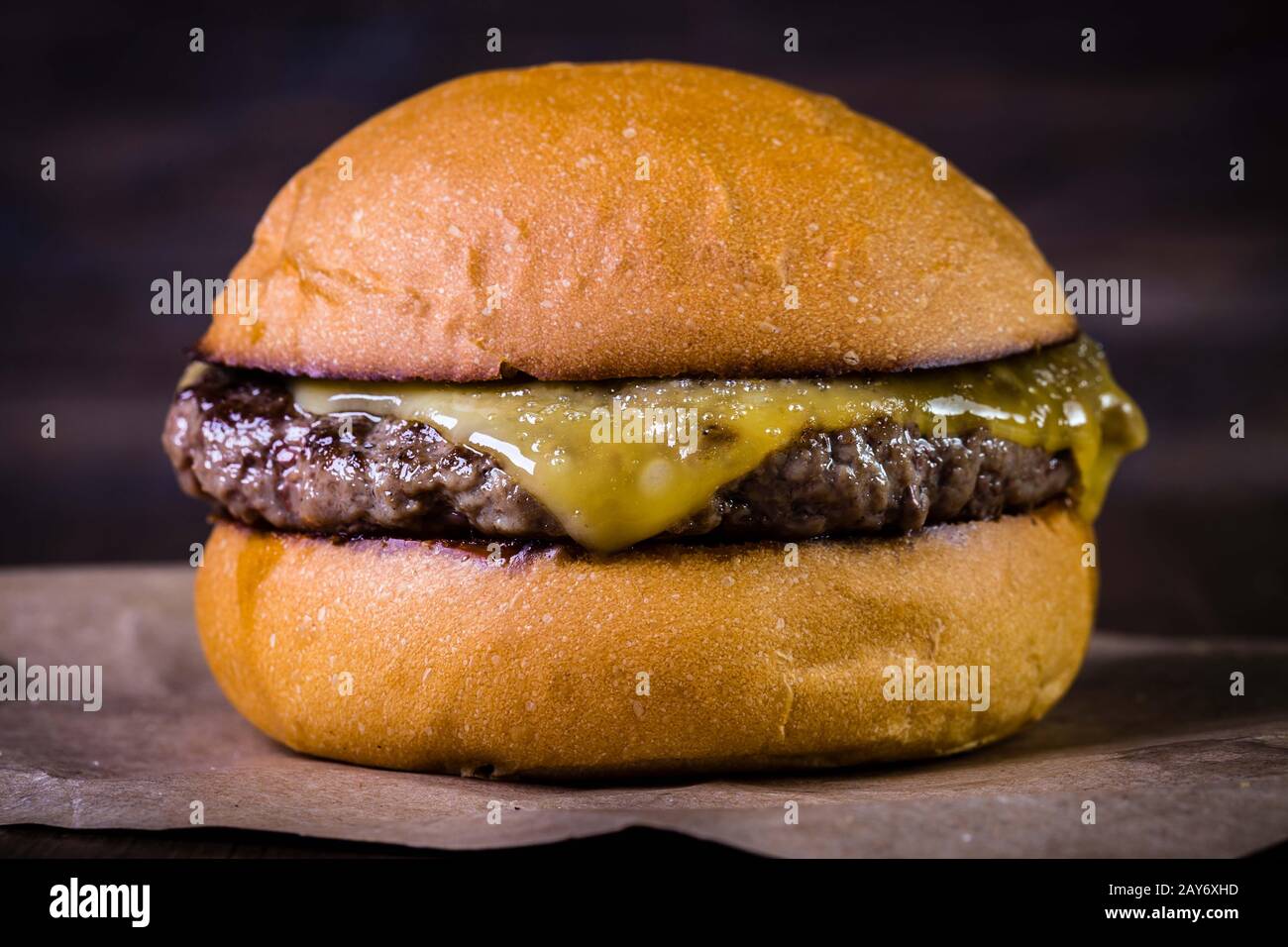 Craft beef burger with cheese on wood table and rustic background Stock ...
