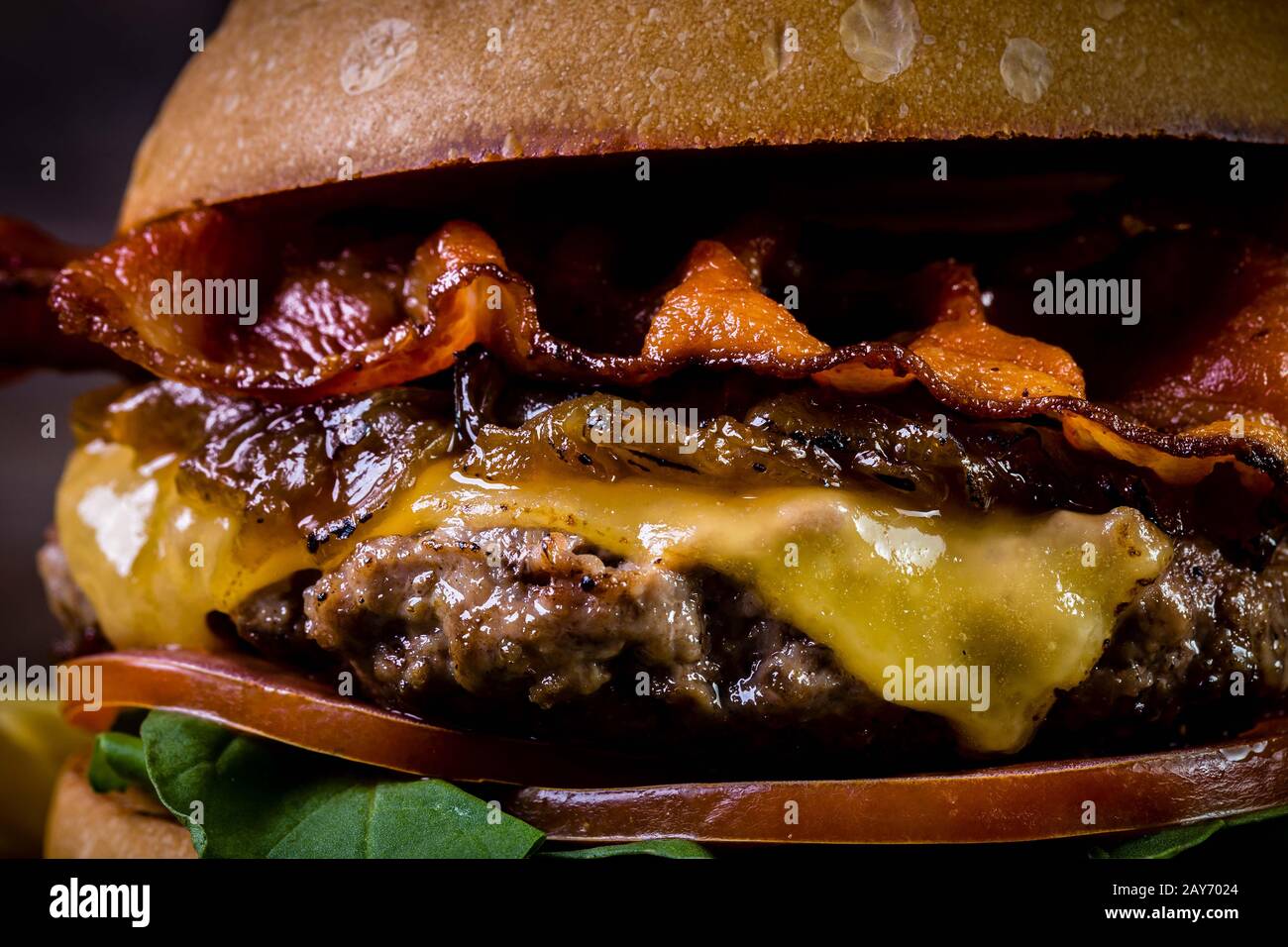 Craft beef burger with cheese, bacon, caramelized onion and rocket ...