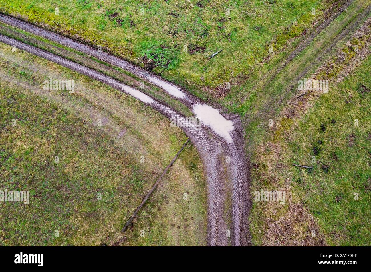 tractor path in the winter from above with a curve Stock Photo - Alamy