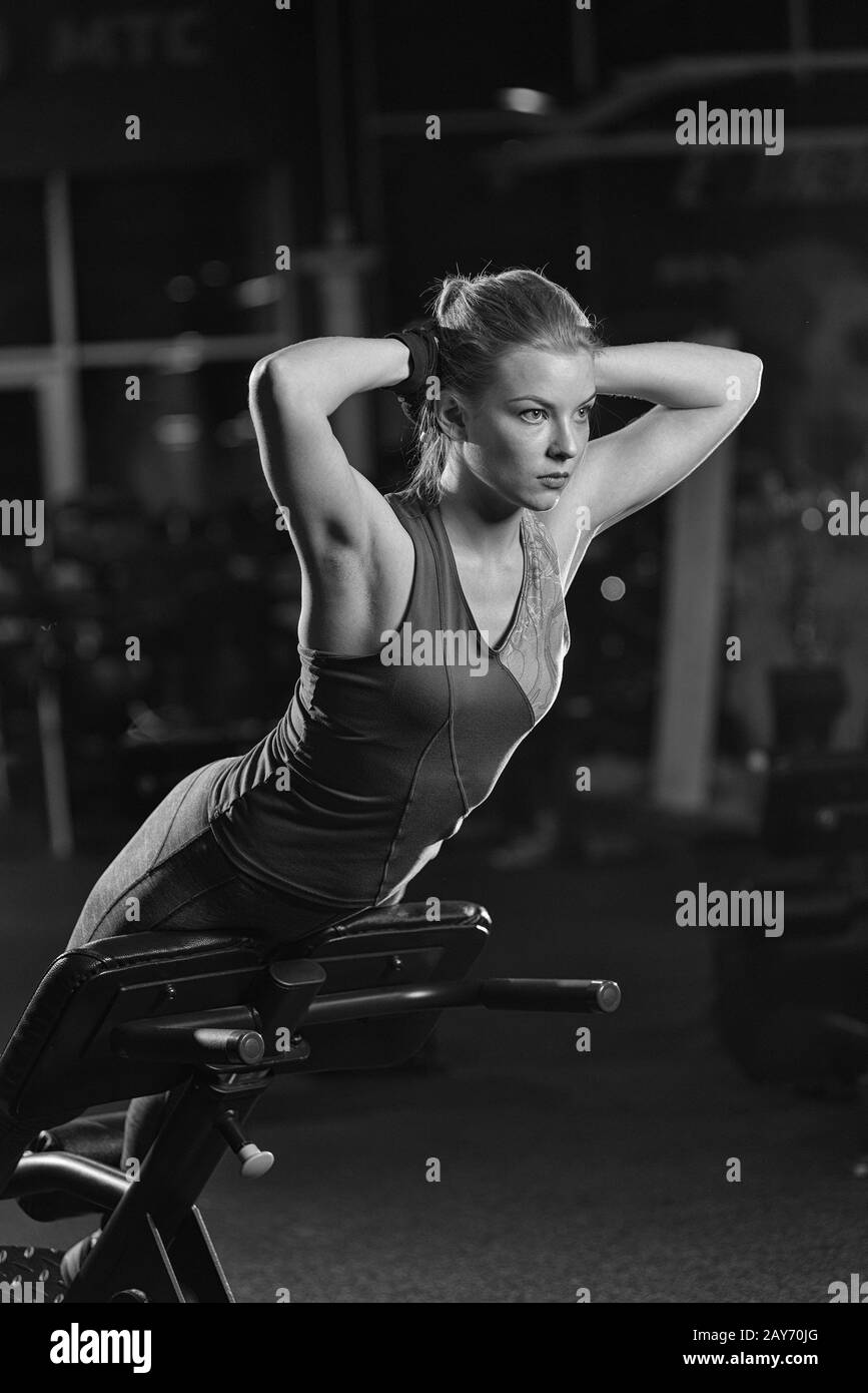 Woman doing strength exercises for abs muscles Stock Photo - Alamy