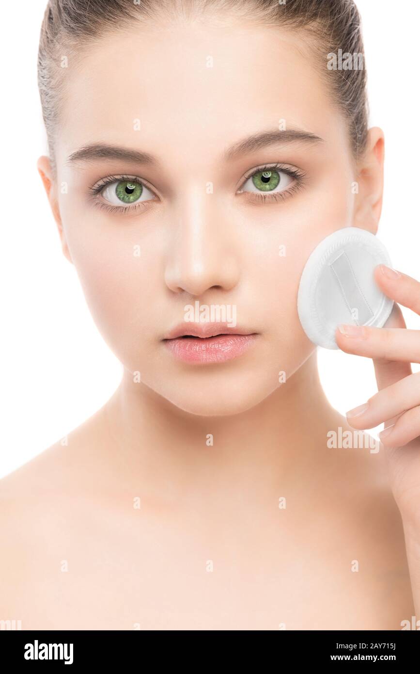 Young woman cares for face skin. Cleaning perfect fresh skin using ...