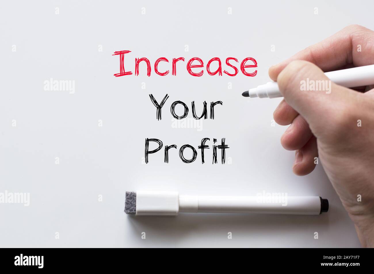 Increase your profit written on whiteboard Stock Photo - Alamy