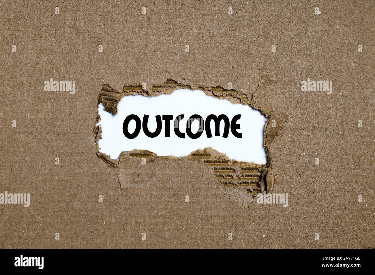 The word outcome appearing behind torn paper Stock Photo - Alamy