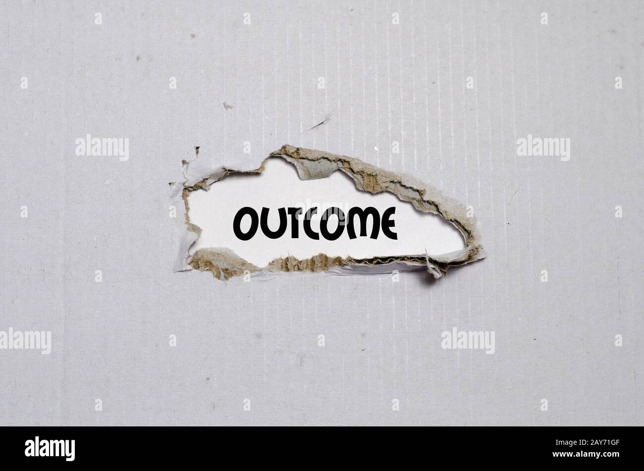 The word outcome appearing behind torn paper Stock Photo - Alamy