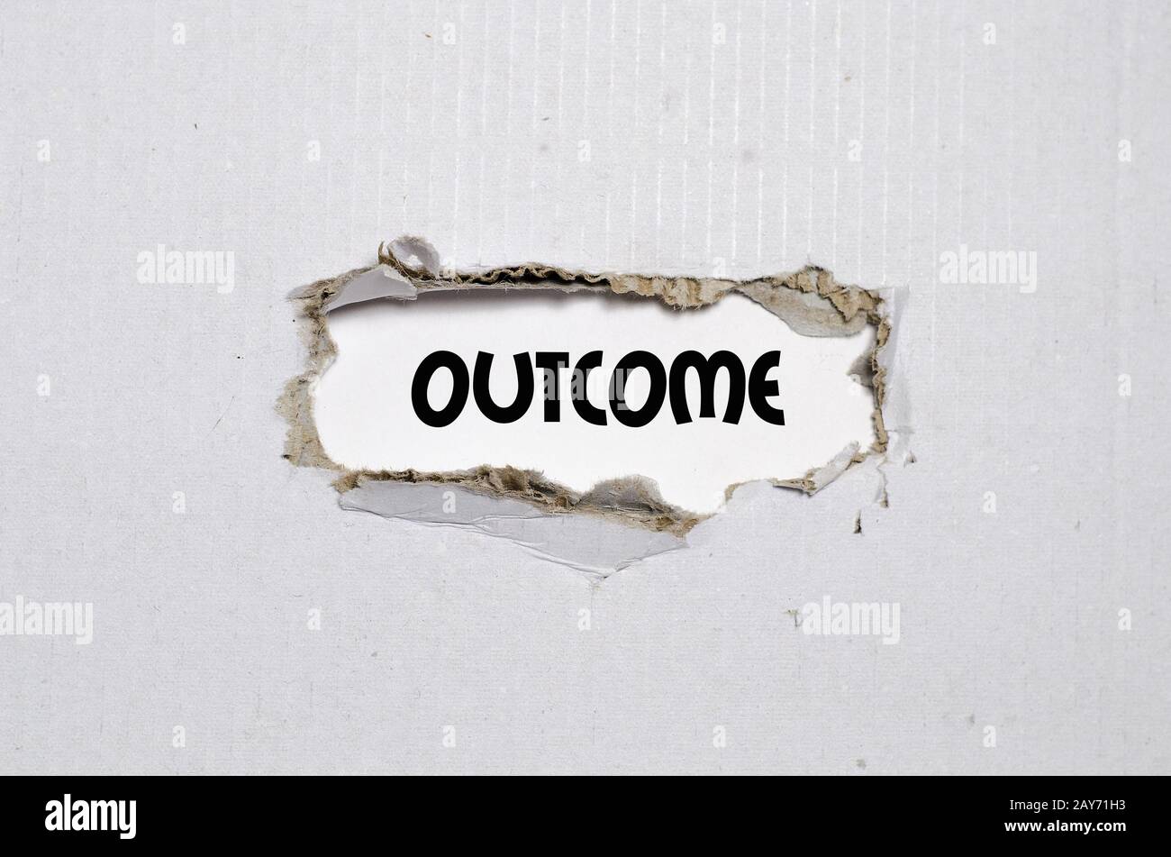 The word outcome appearing behind torn paper Stock Photo - Alamy