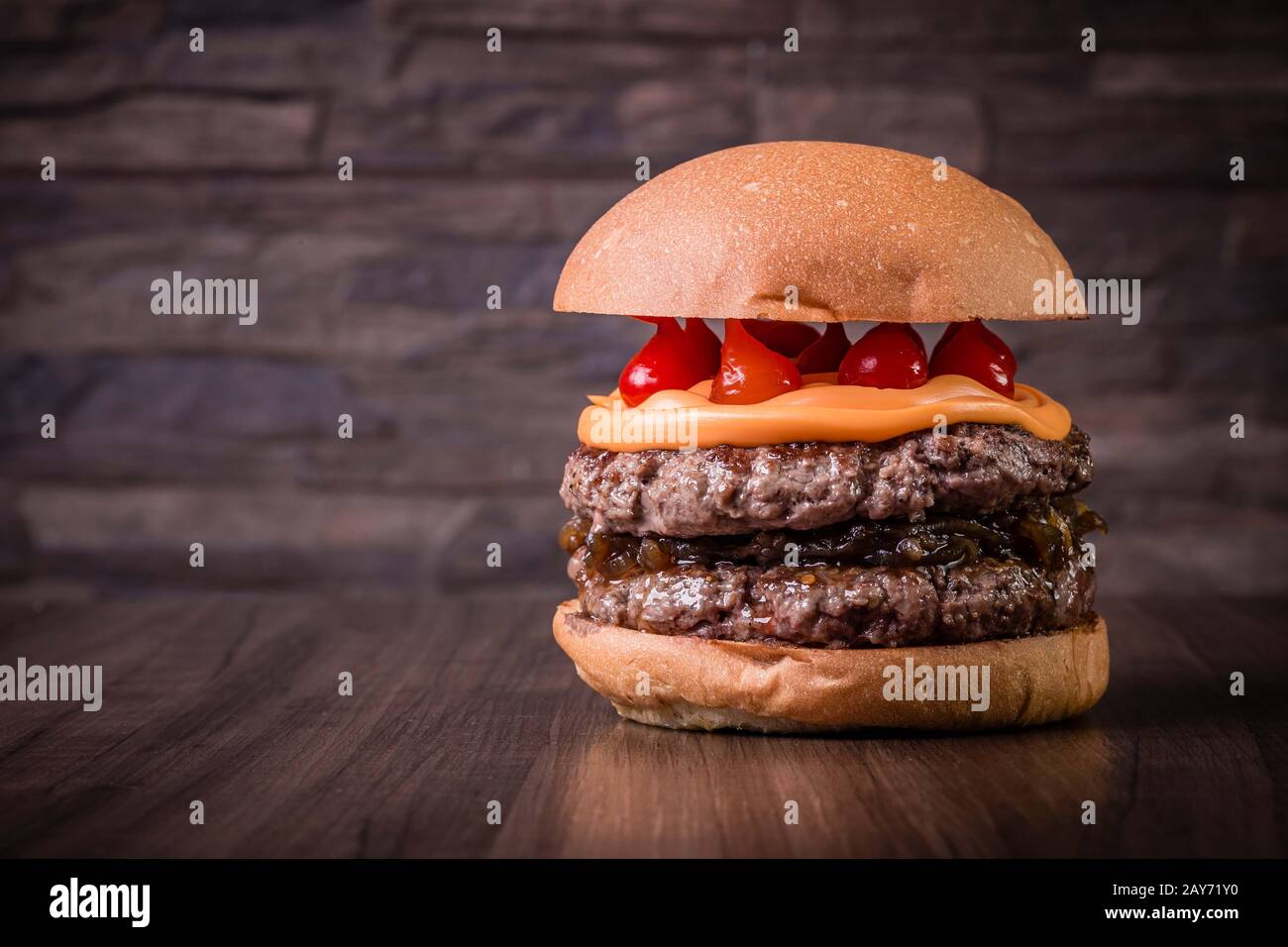 Double craft beef burger with cheddar cheese, caramelized onion and ...