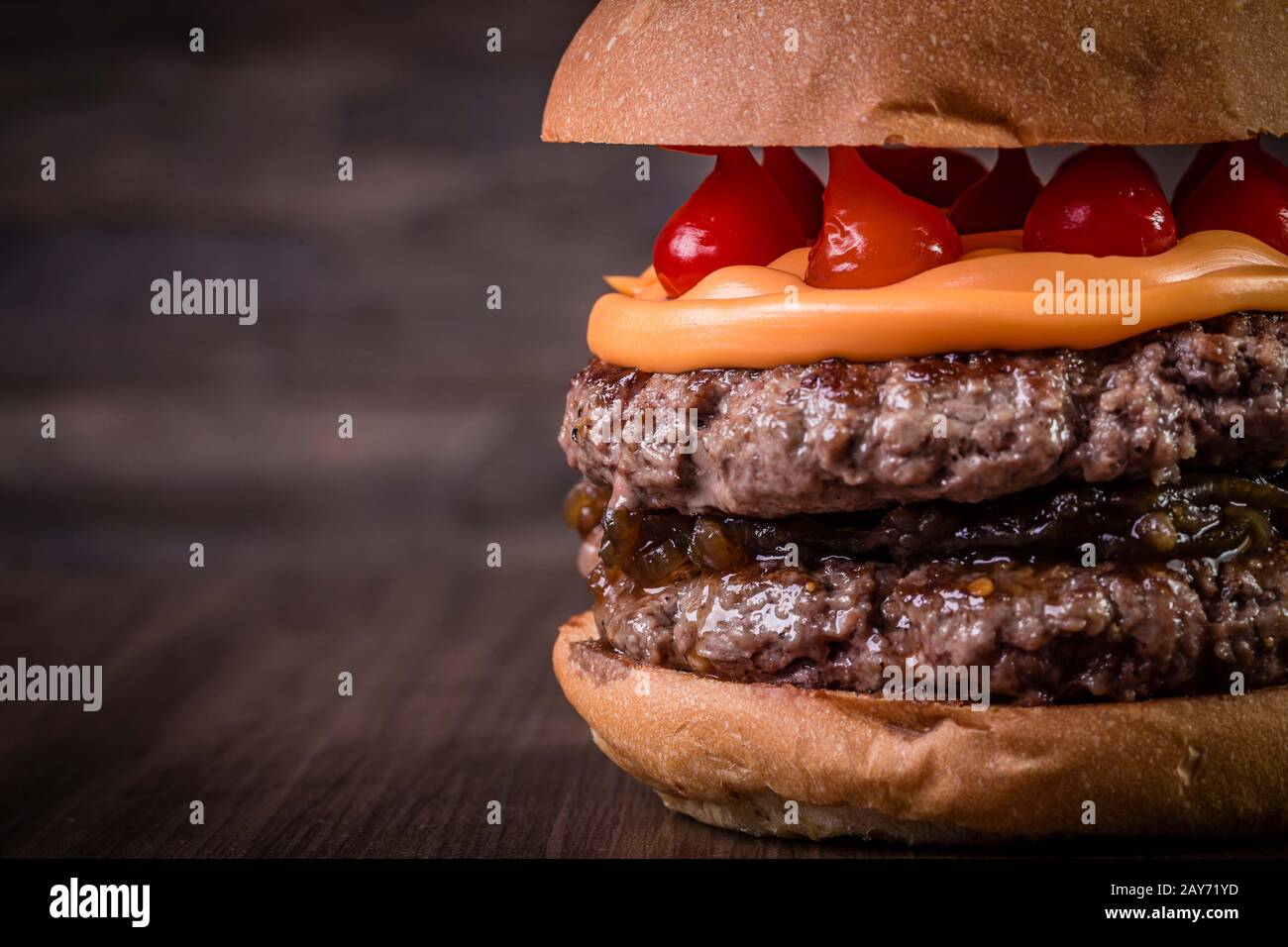 Double craft beef burger with cheddar cheese, caramelized onion and ...