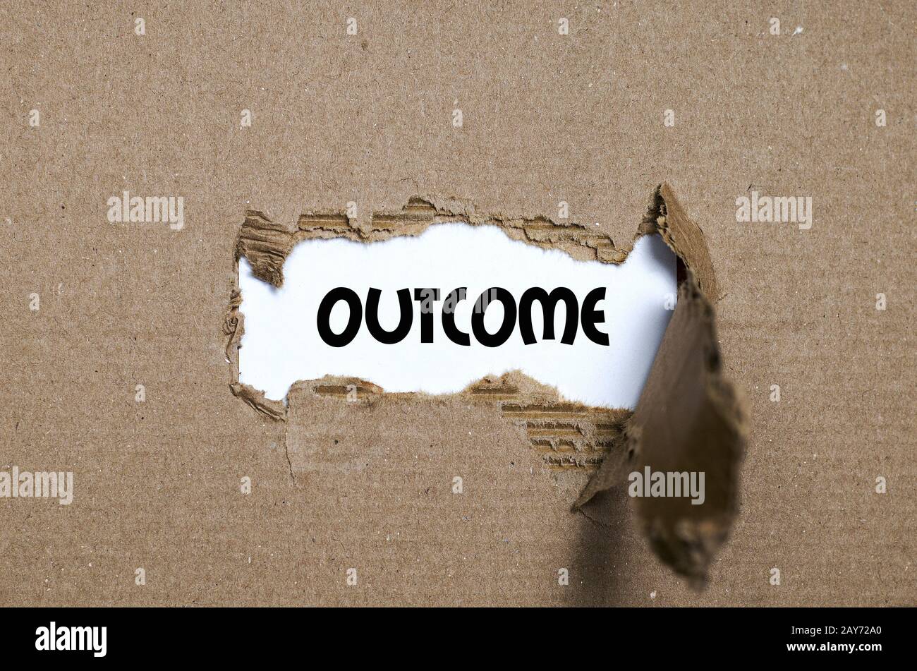 The word outcome appearing behind torn paper Stock Photo - Alamy