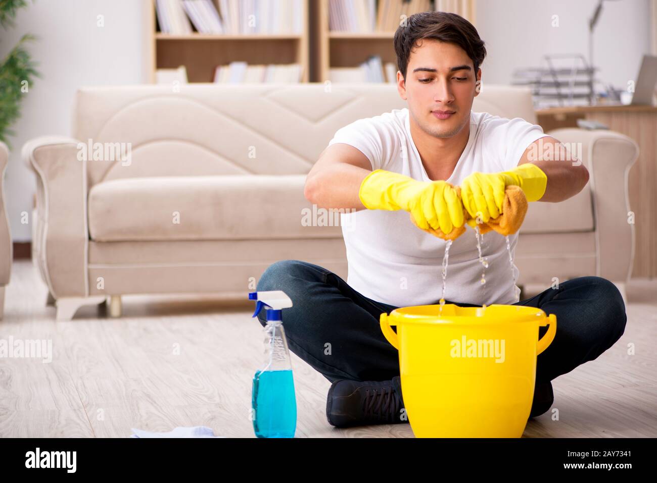 Man husband cleaning the house helping wife Stock Photo - Alamy