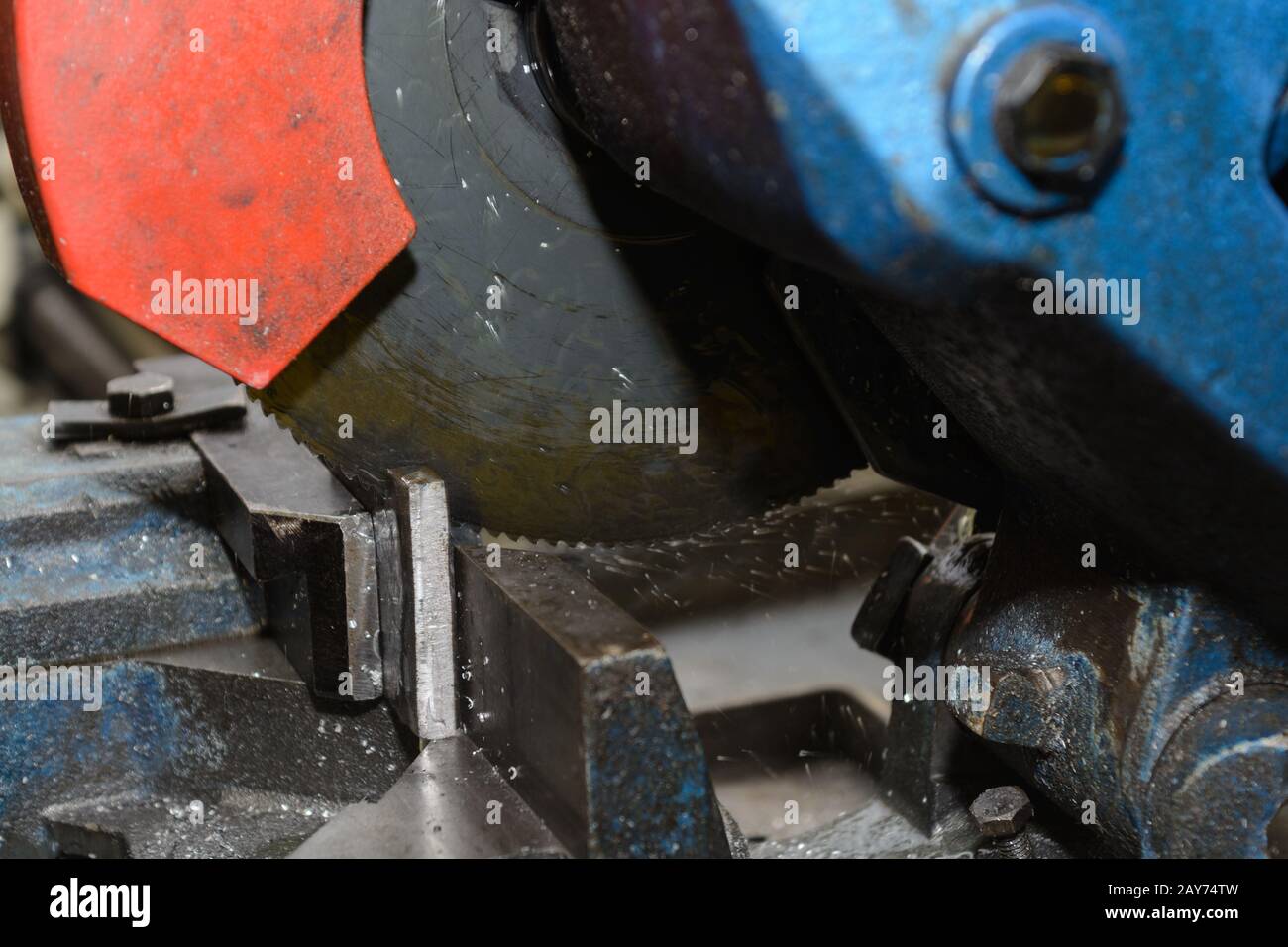 Metal is cut on an electric metal mitre saw - close up Stock Photo - Alamy