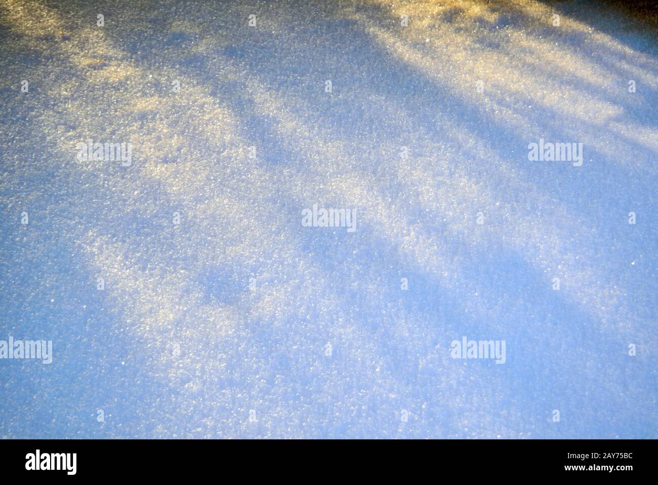 Close up of snow texture in light blue. Shadows in the snow close-up ...