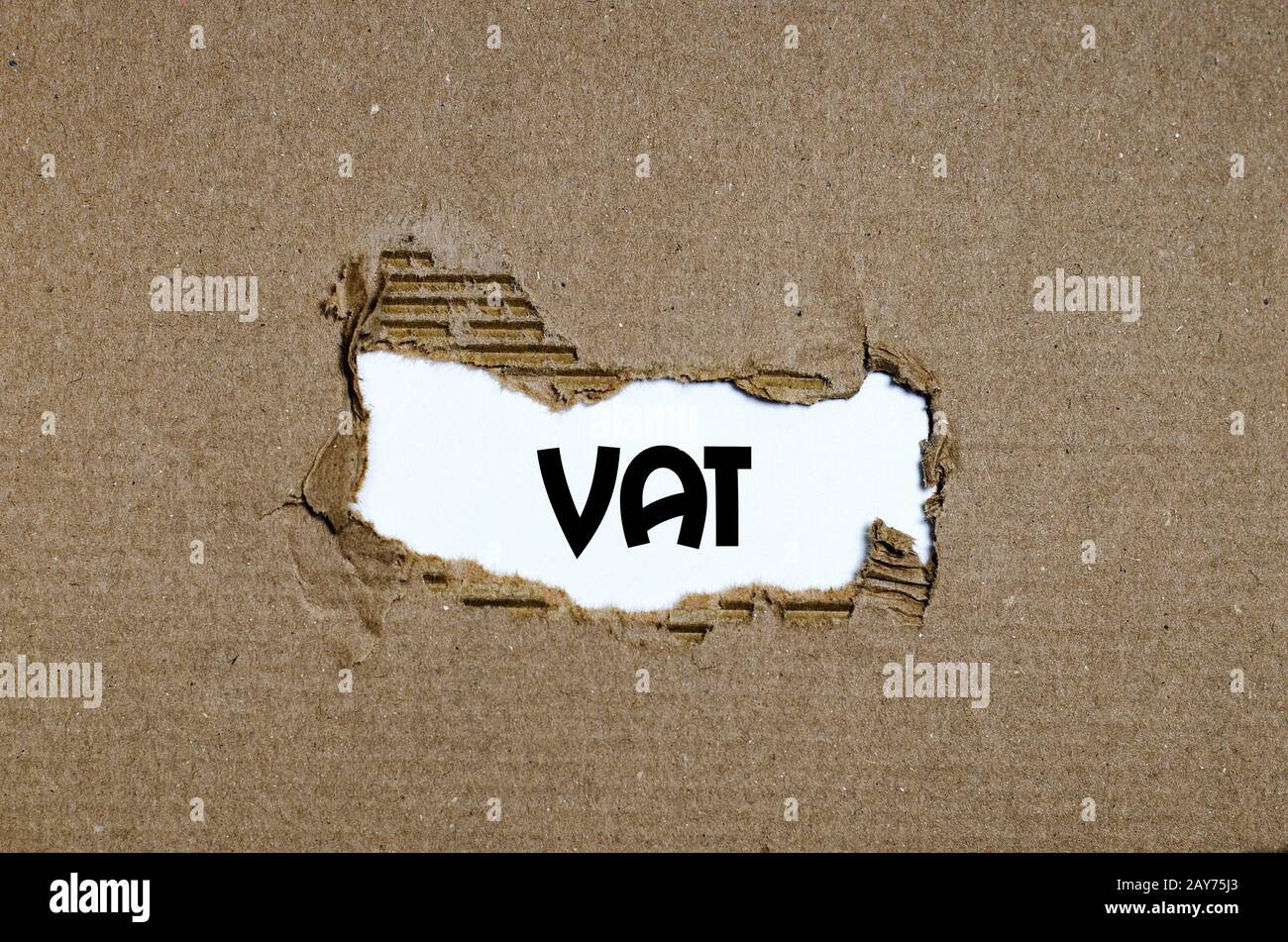 The word vat appearing behind torn paper Stock Photo - Alamy