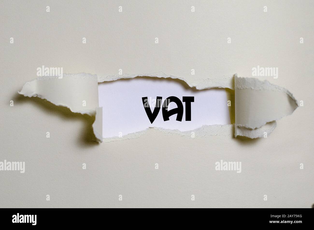 The word vat appearing behind torn paper Stock Photo - Alamy
