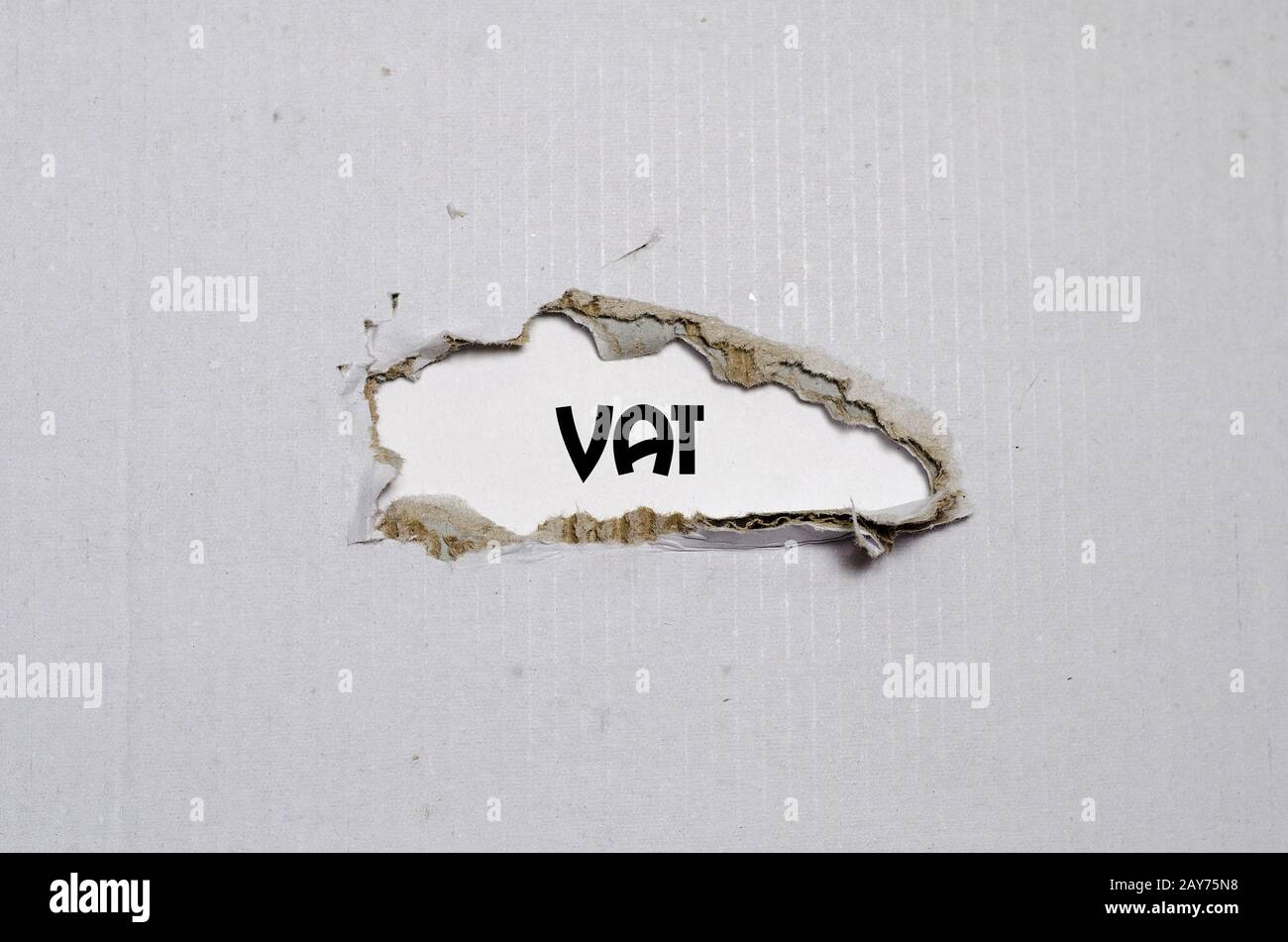The word vat appearing behind torn paper Stock Photo - Alamy