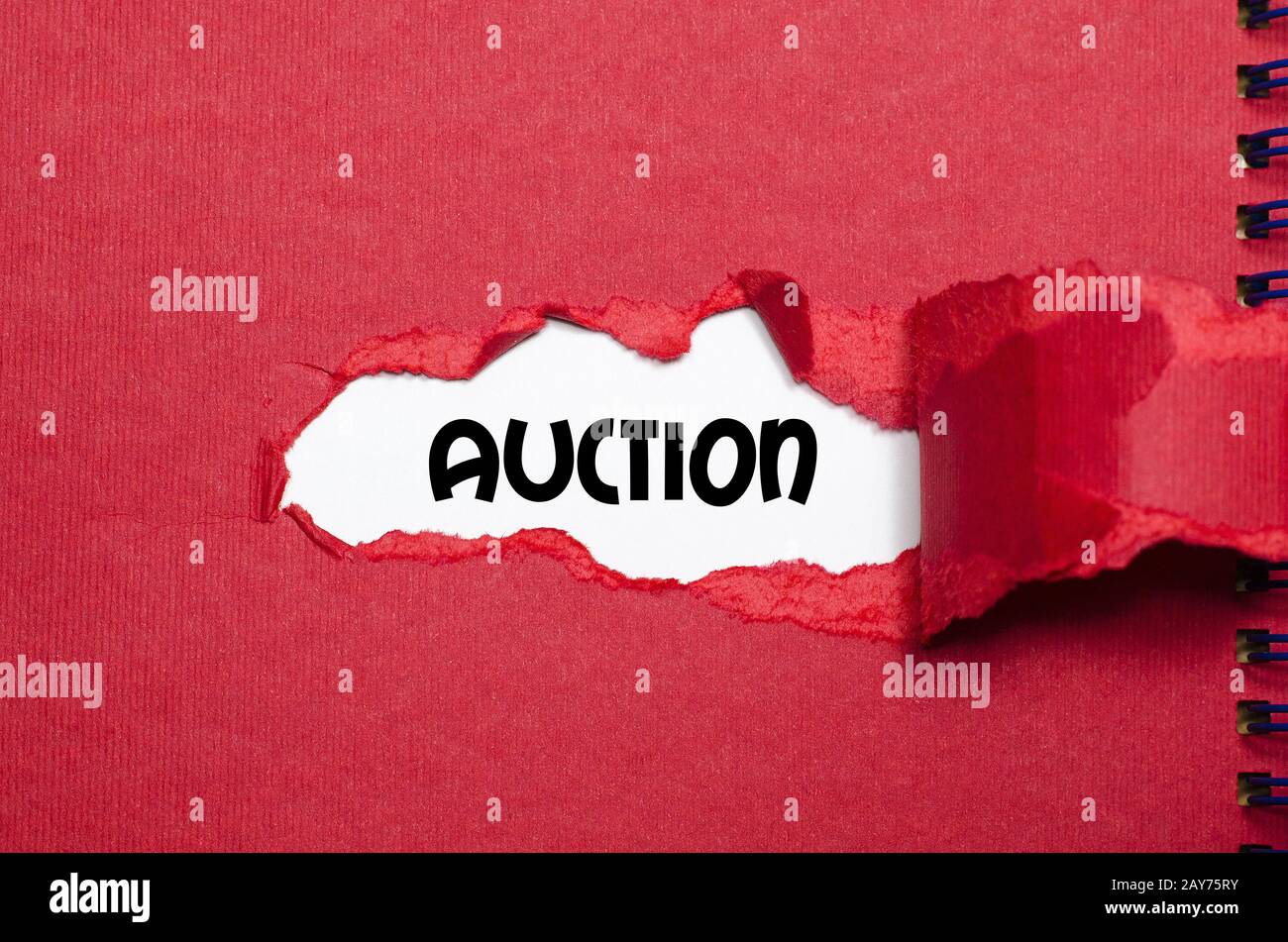 The word auction appearing behind torn paper Stock Photo - Alamy