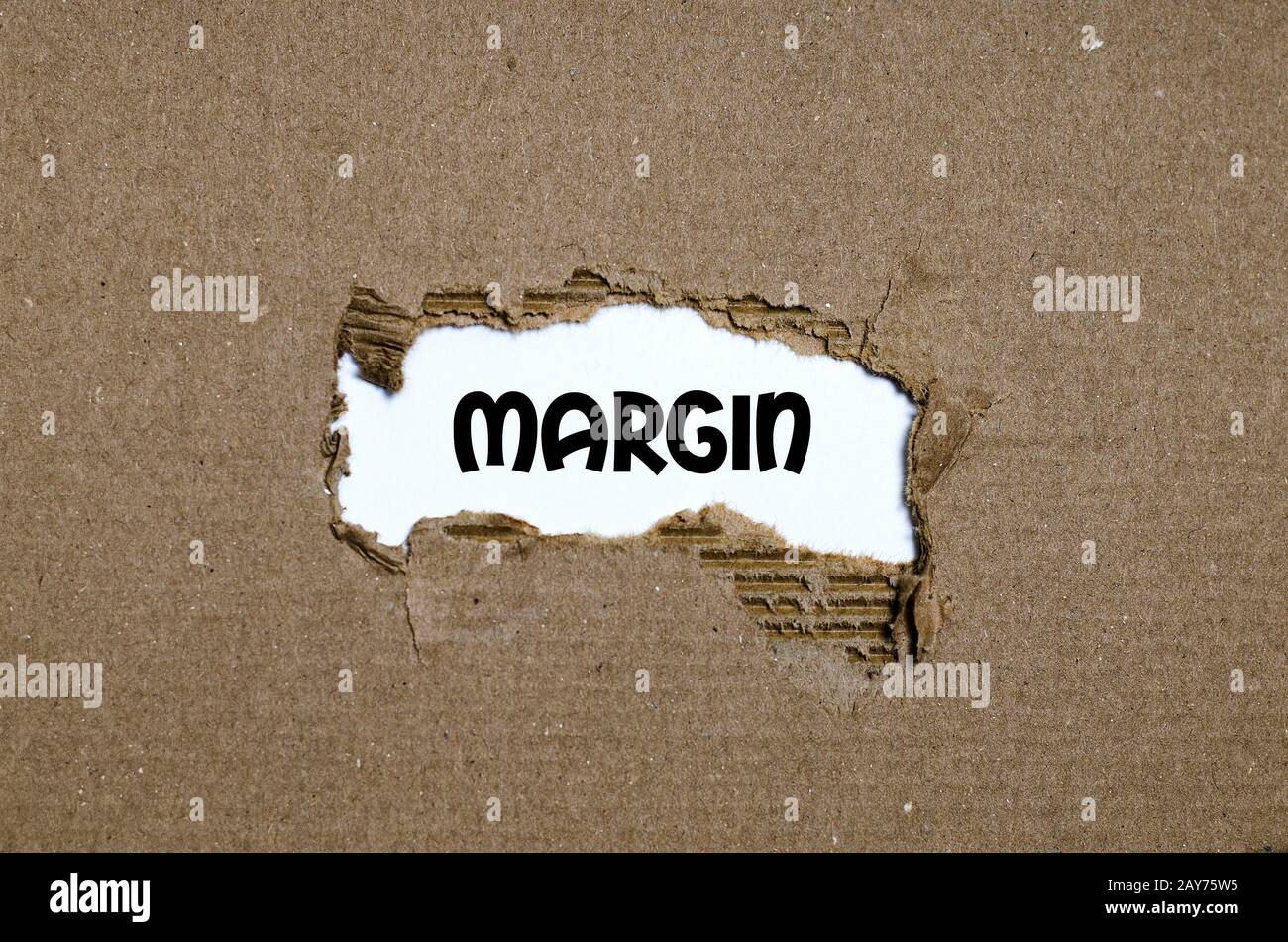 The word margin appearing behind torn paper Stock Photo - Alamy