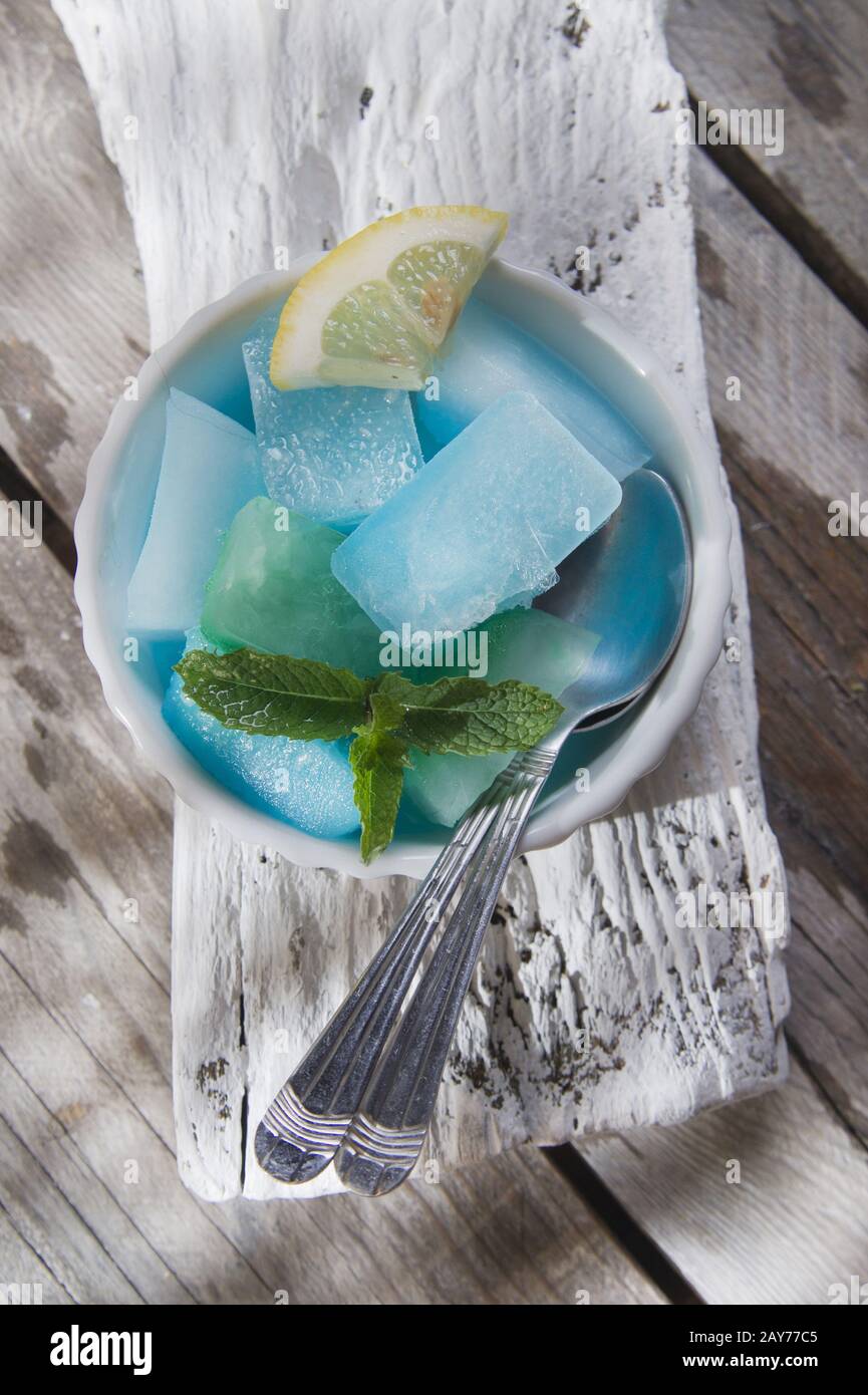 Bowl of colored ice-cubes Stock Photo - Alamy
